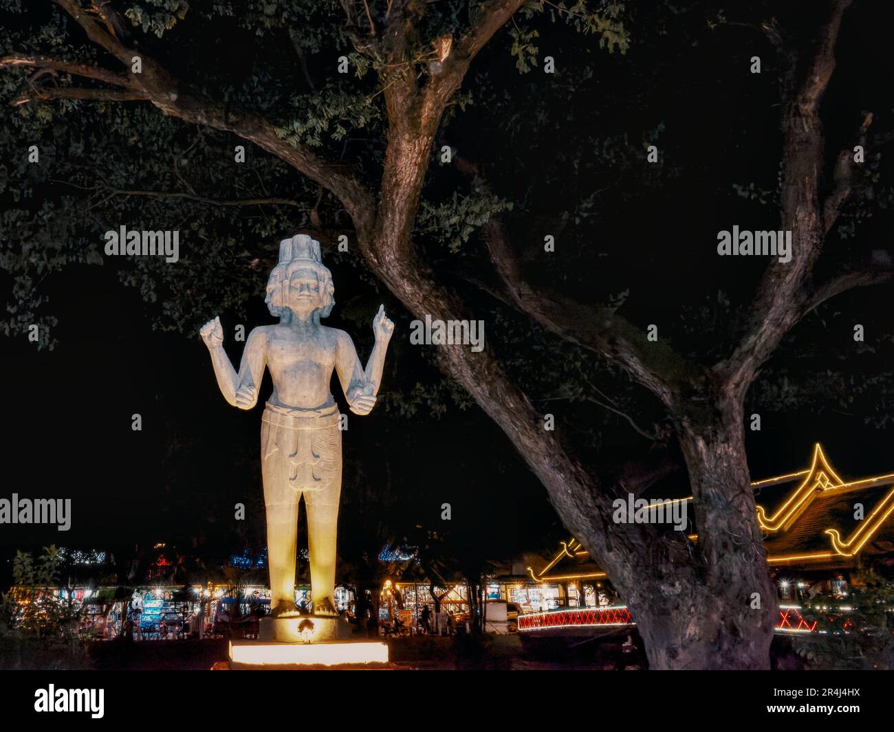 A sculptural image of a multi-faced and multi-armed Hindu deity ...