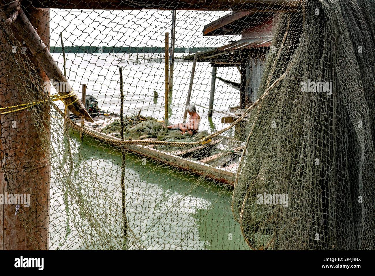 Chantaburi, Thailand, Mar 21, 23: A fishing net hangs on a bamboo bar ...