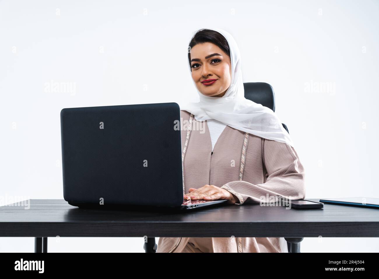 Beautiful arab middle-eastern corporate businesswoman with traditional ...