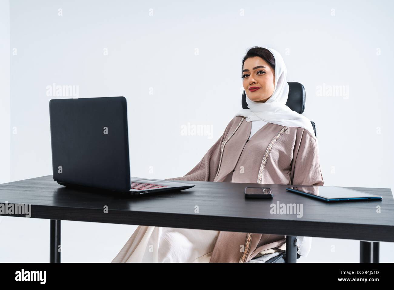 Beautiful arab middle-eastern corporate businesswoman with traditional ...