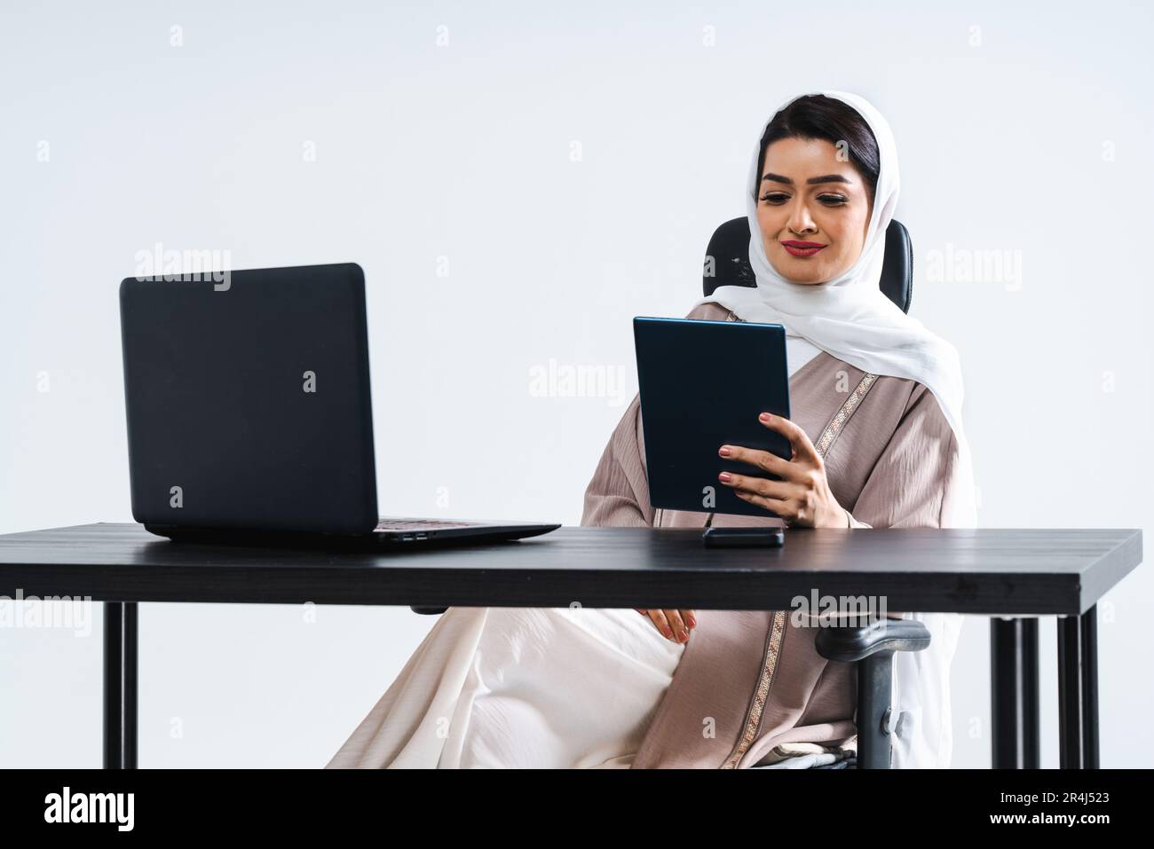 Beautiful arab middle-eastern corporate businesswoman with traditional ...