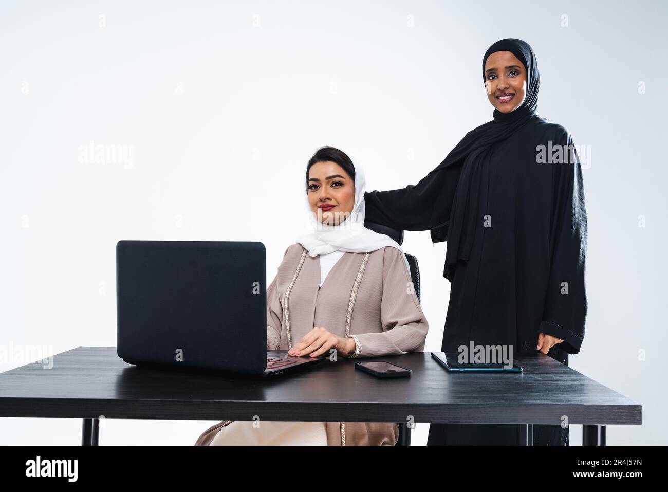 Beautiful arab middle-eastern women with traditional abaya dress in ...
