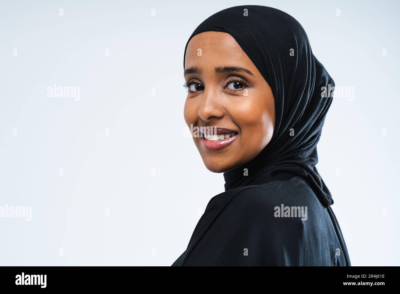 Beautiful arab middle-eastern woman with traditional abaya dress in studio - Arabic muslim adult ...
