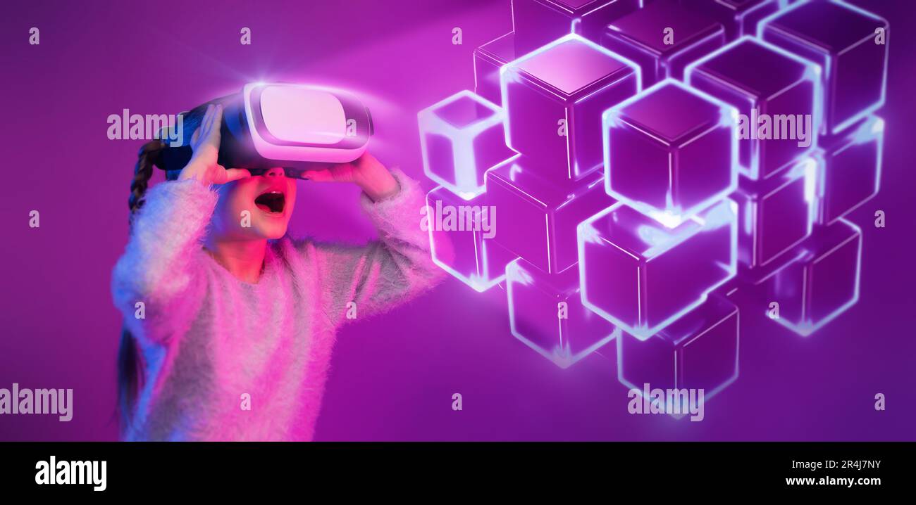 Excited little girl wearing vr glasses enjoying online game with ...