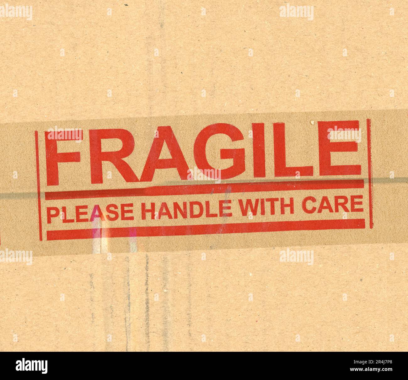 fragile please handle with care brown corrugated cardboard box Stock Photo - Alamy