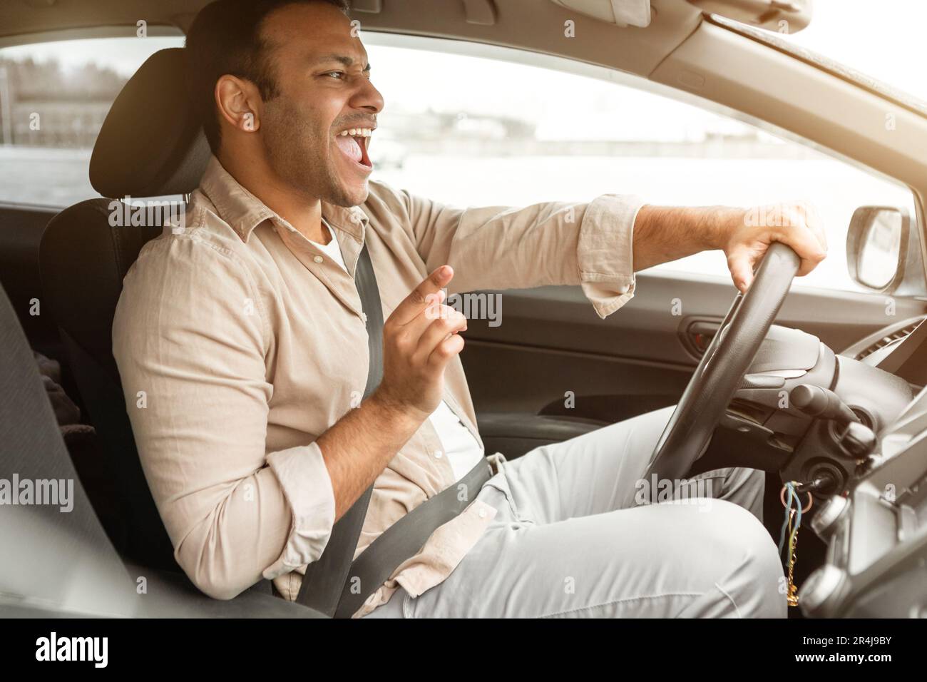 Joyful Indian Driver Man Singing While Driving His New Car Stock Photo ...