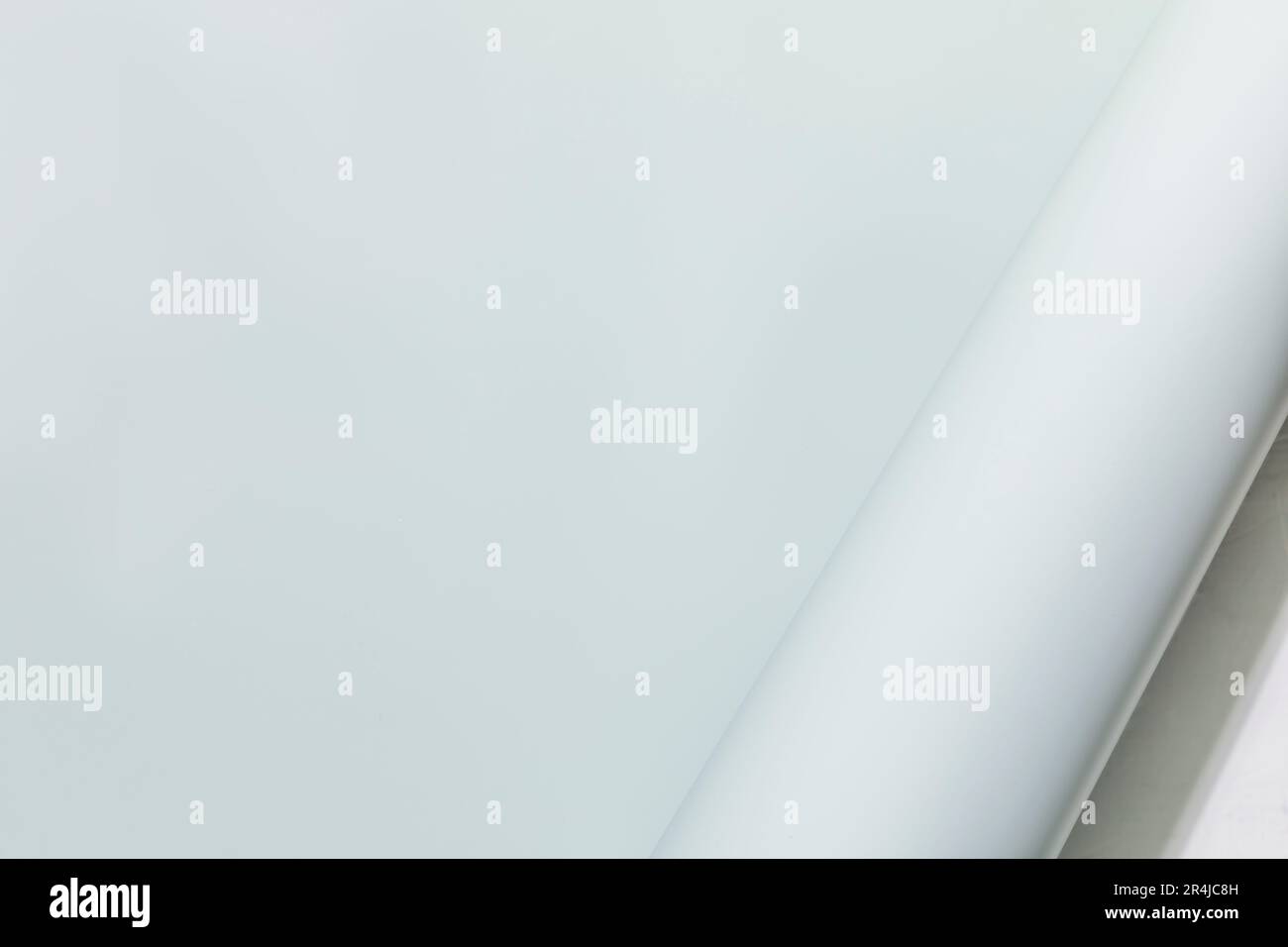 Light blue paper sheet with twisted corner Stock Photo - Alamy