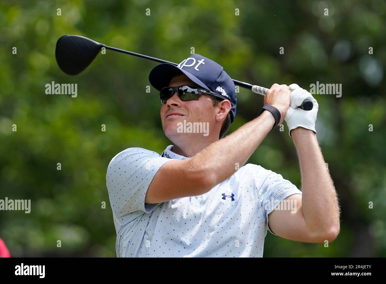 Adam Schenk hits a tee shot on the second hole during the final round ...