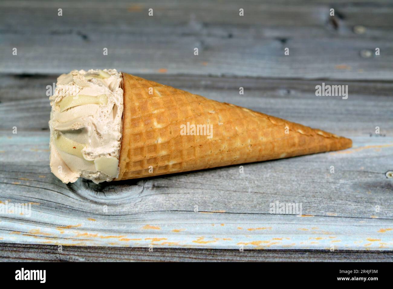 Ice-cream of special flavors in crispy wafer cones, melting cold ice ...