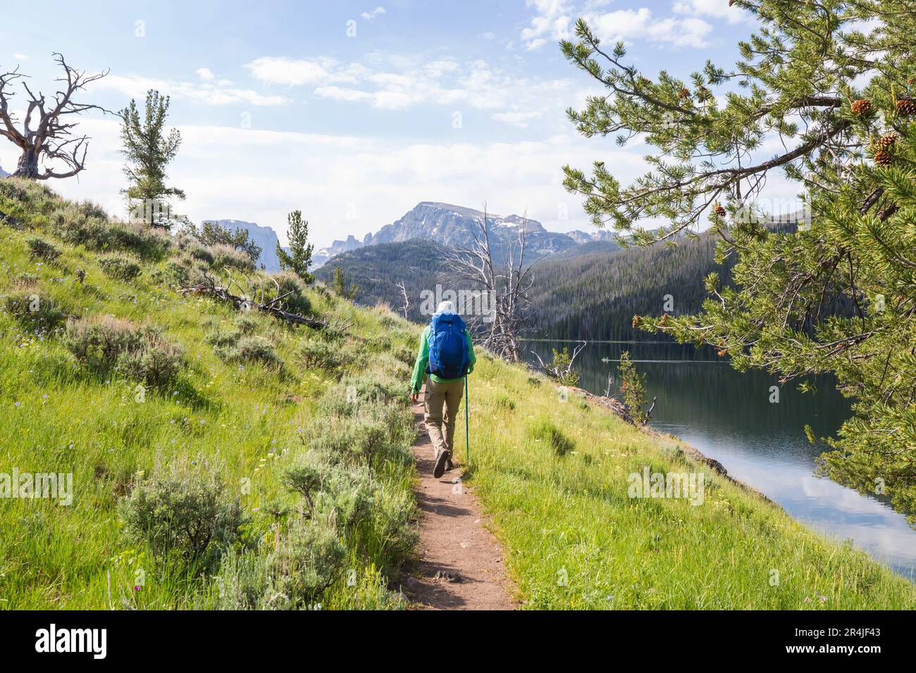 hiker in mountains on beautiful rock background Stock Photo - Alamy