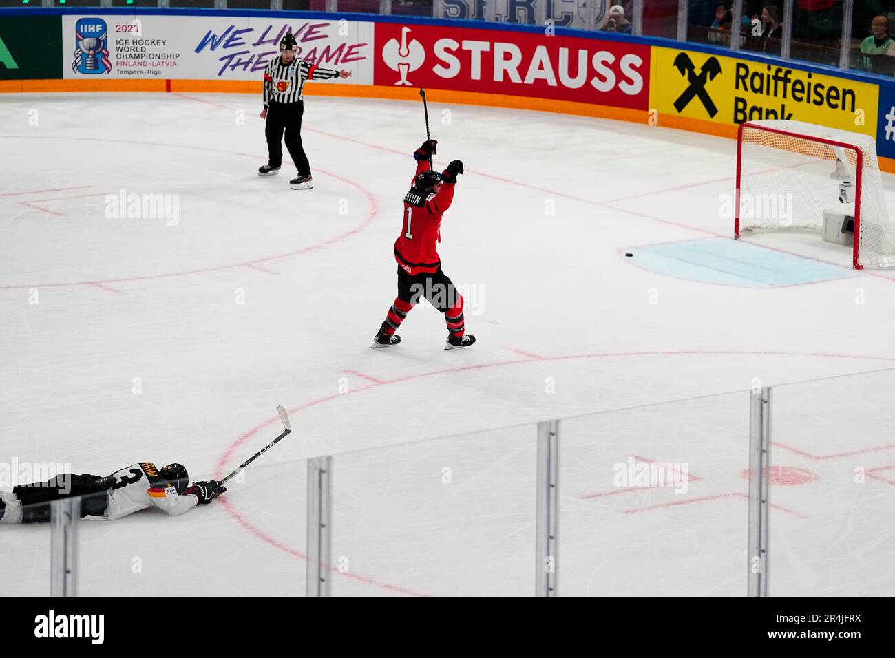 Canada's Scott Laughton celebrates his empty net goal as Germany's John ...