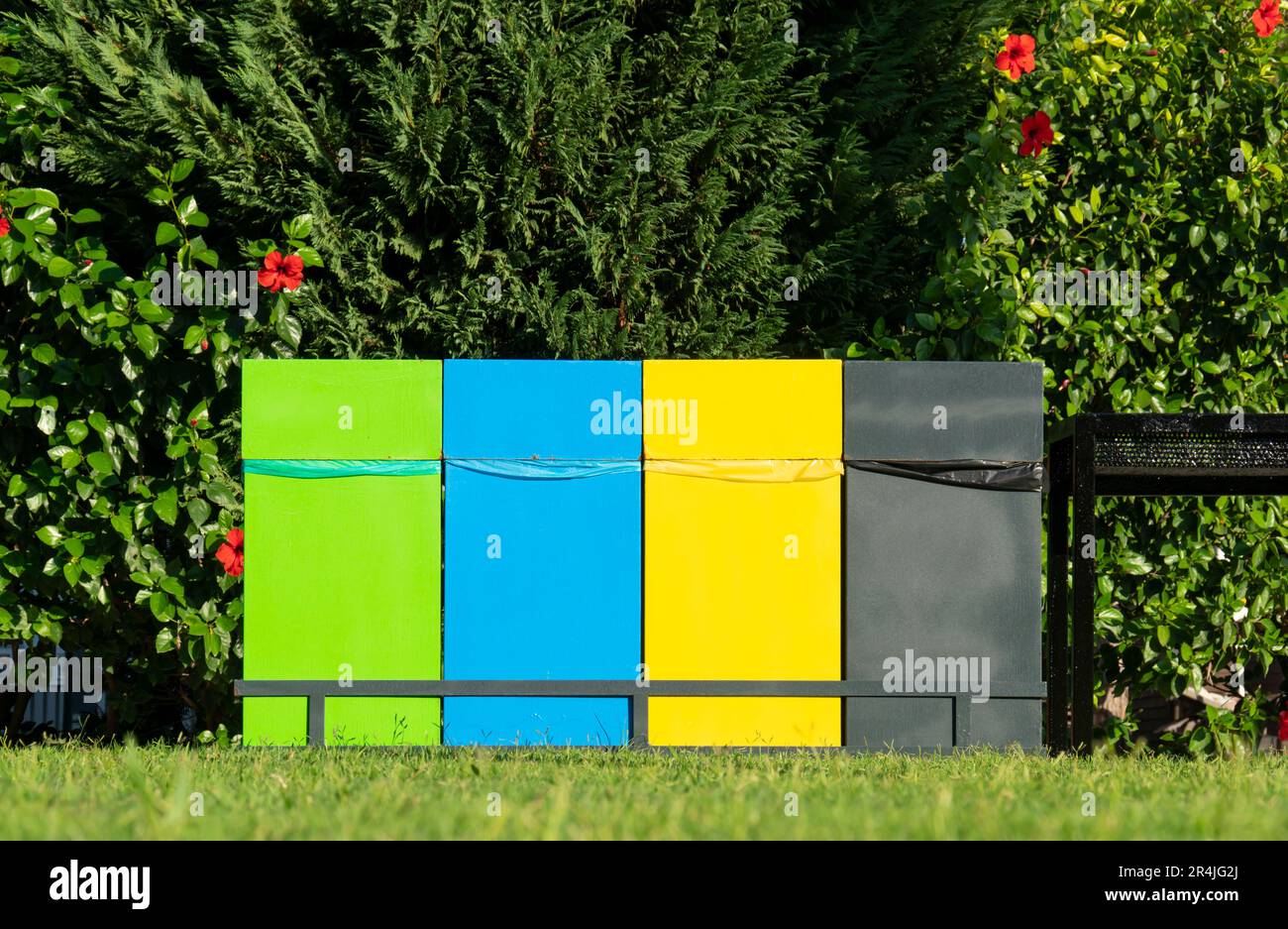 Different colored trash cans for paper, plastic, glass and organic ...