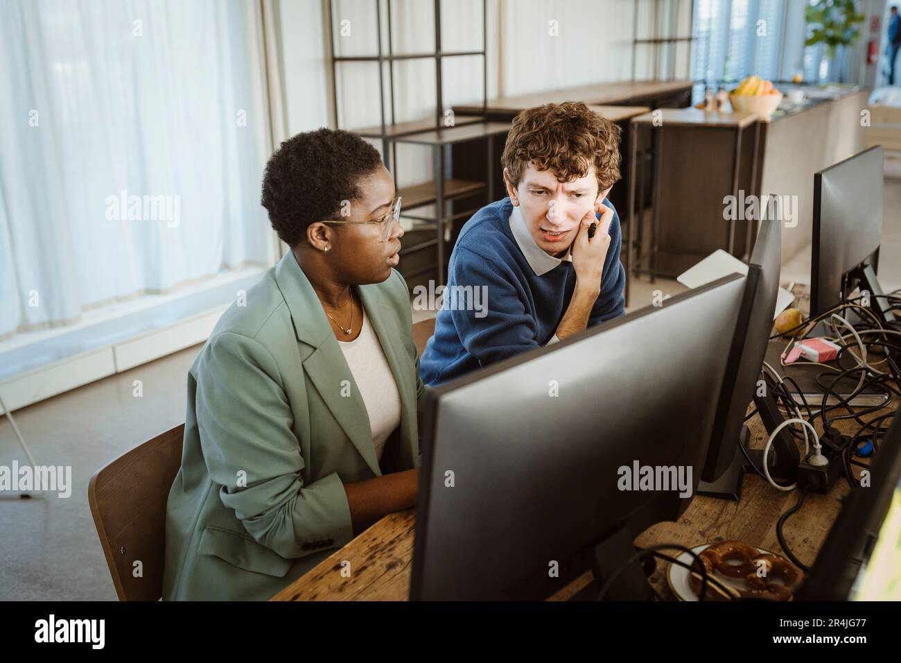 Multiracial programmers hi-res stock photography and images - Alamy
