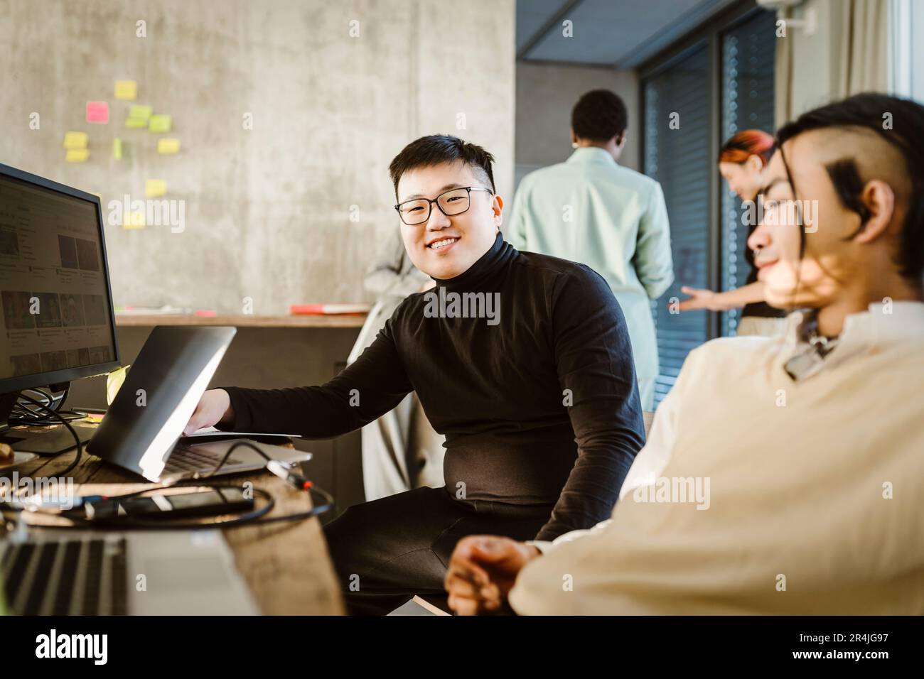 Smiling programmer in eyeglasses hi-res stock photography and images ...