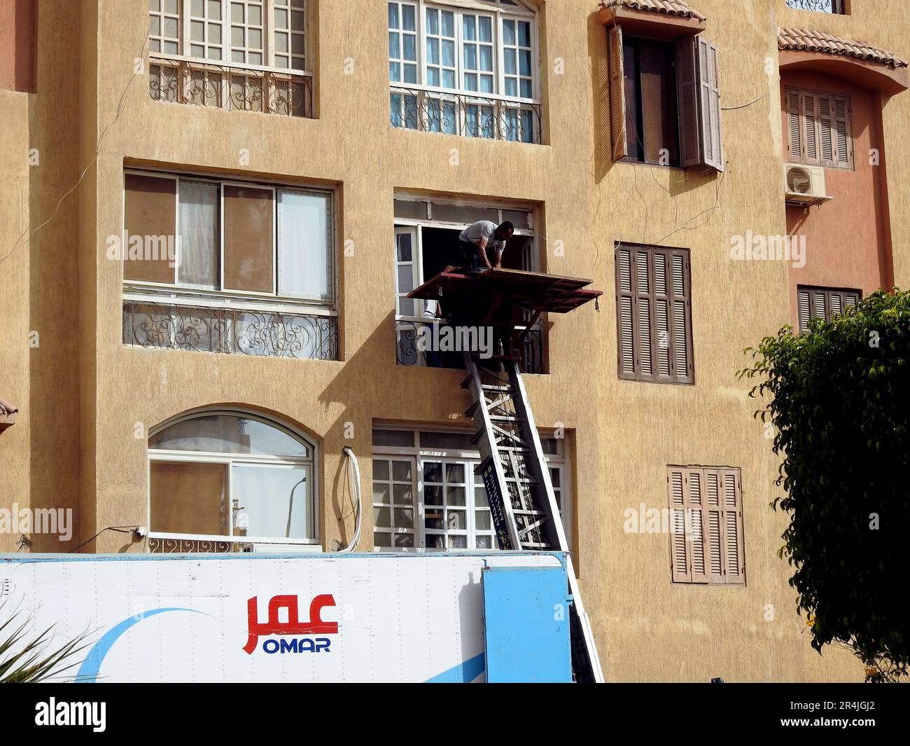 Cairo, Egypt, May 11 2023: Electric lifting winch vehicle for furniture ...