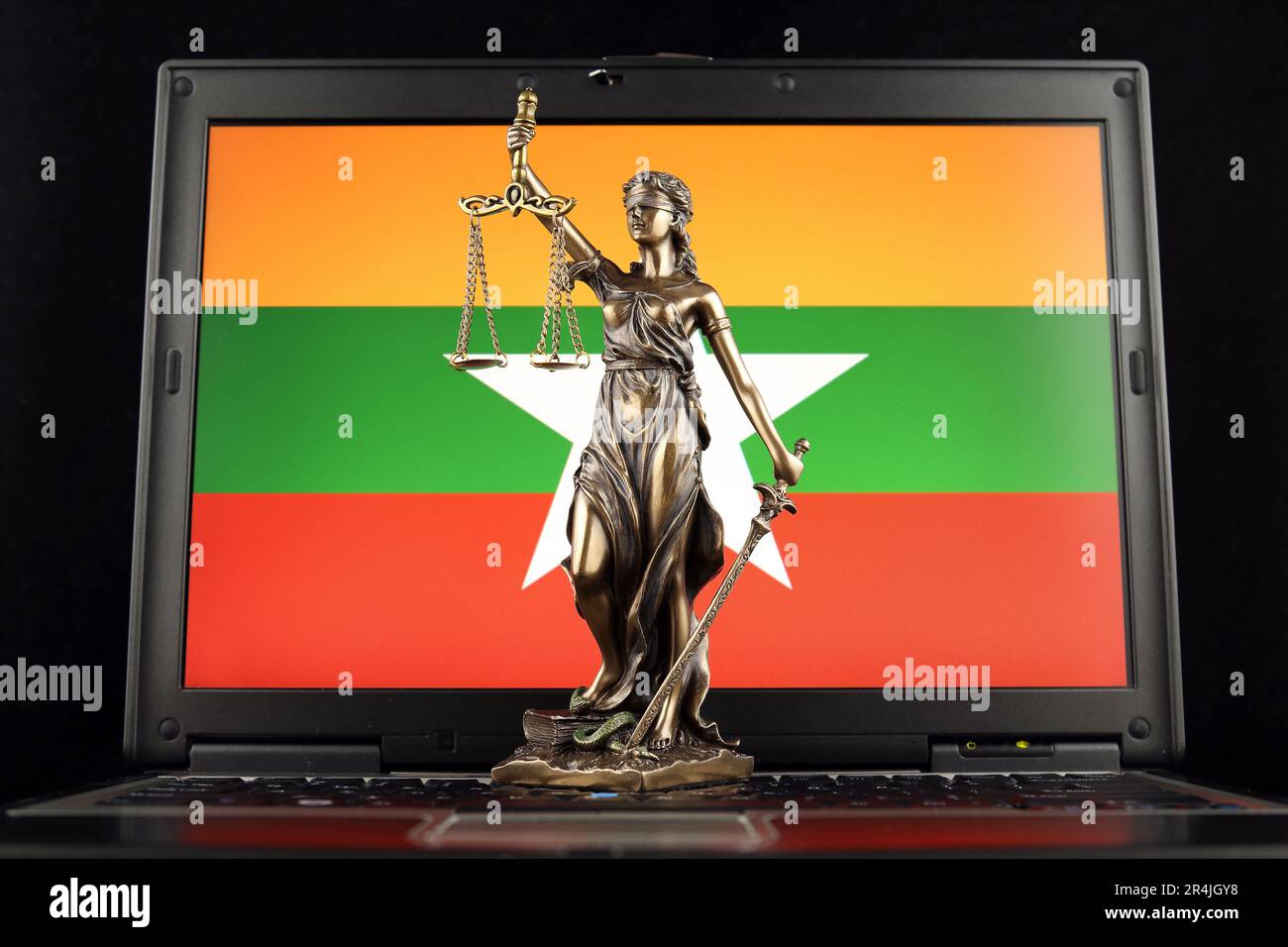 Symbol of law and justice with Myanmar Flag on laptop. Studio shot ...