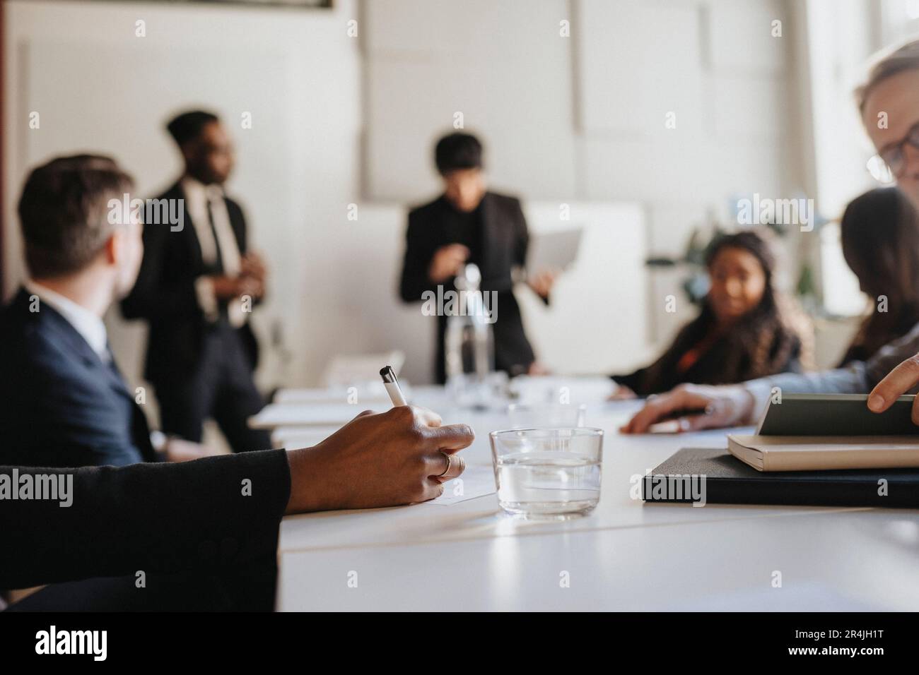 Hand of businesswoman taking down notes during business meeting at ...