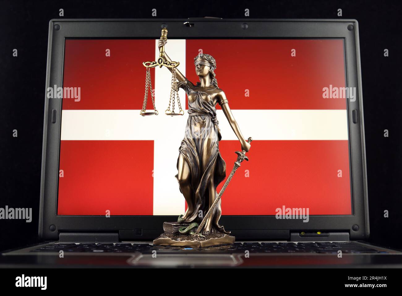 Symbol of law and justice with Denmark Flag on laptop. Studio shot ...