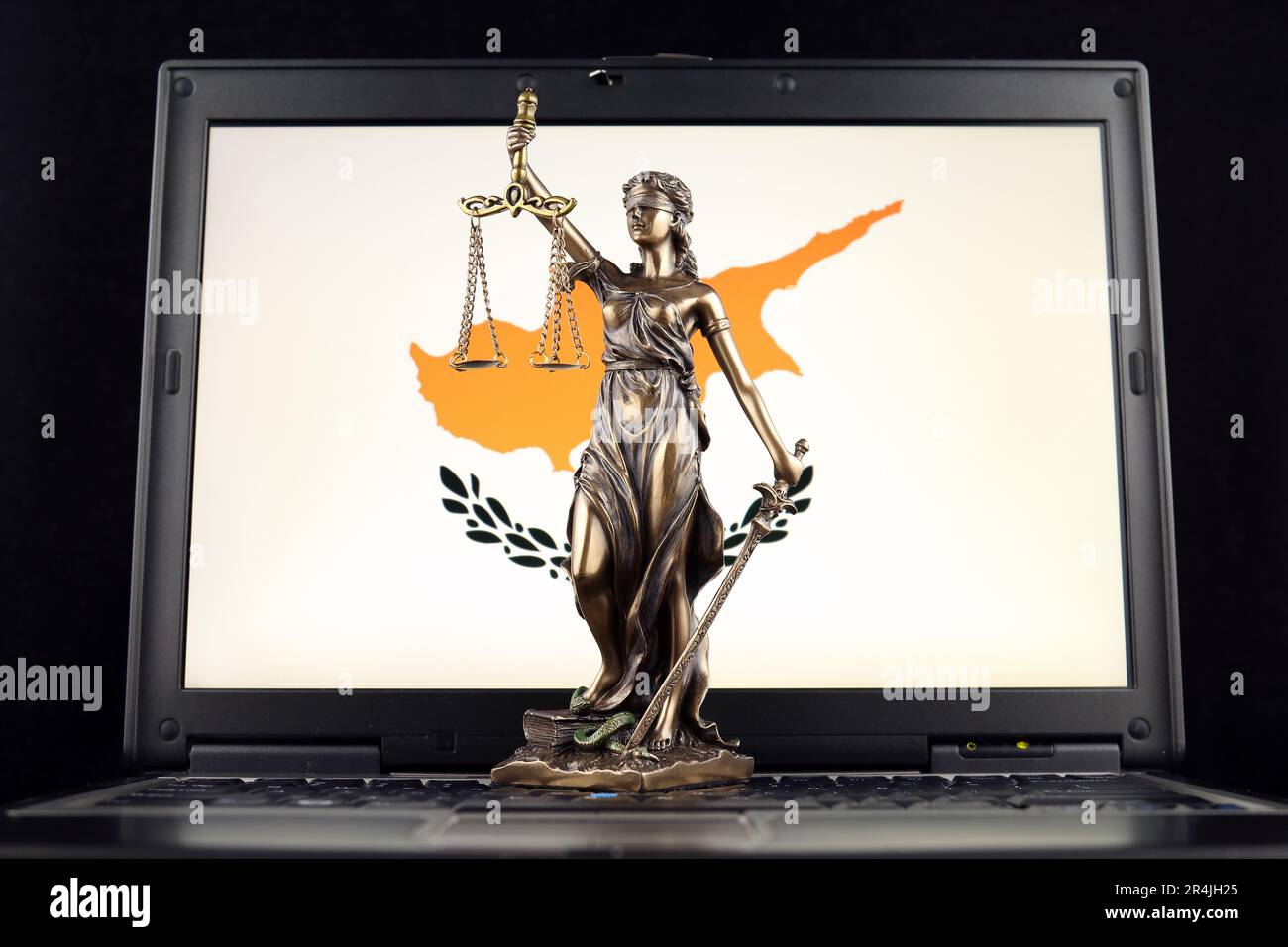 Symbol of law and justice with Cyprus Flag on laptop. Studio shot Stock ...