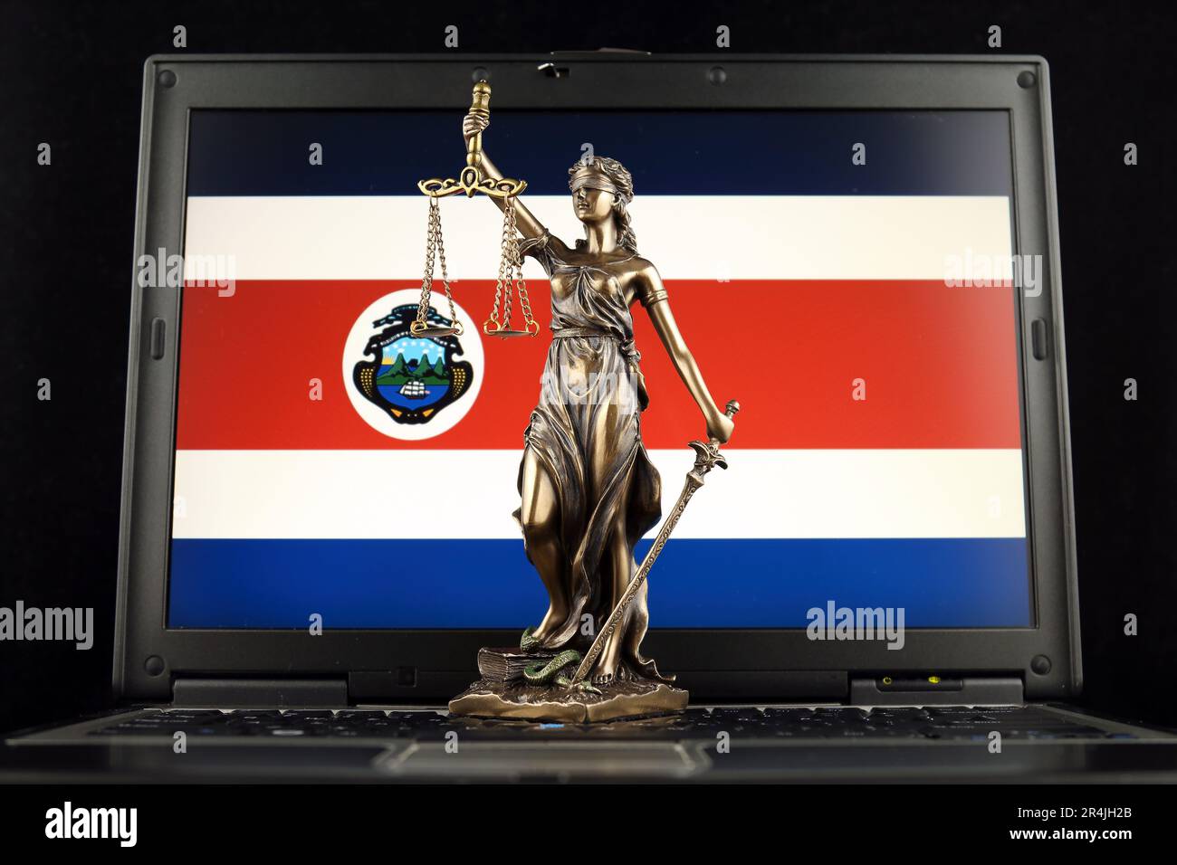 Symbol of law and justice with Costa Rica Flag on laptop. Studio shot ...