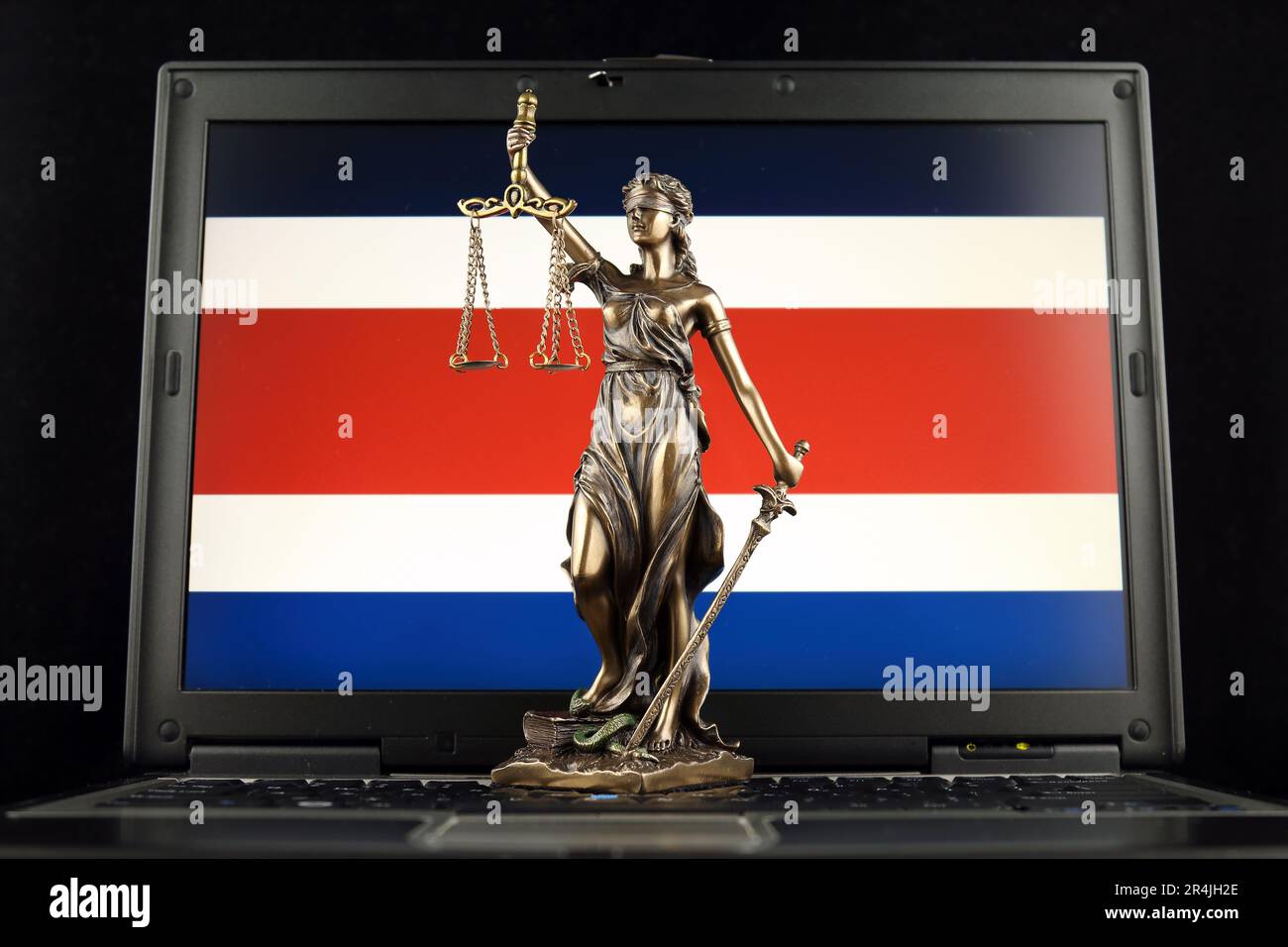Symbol of law and justice with Costa Rica Flag on laptop. Studio shot ...