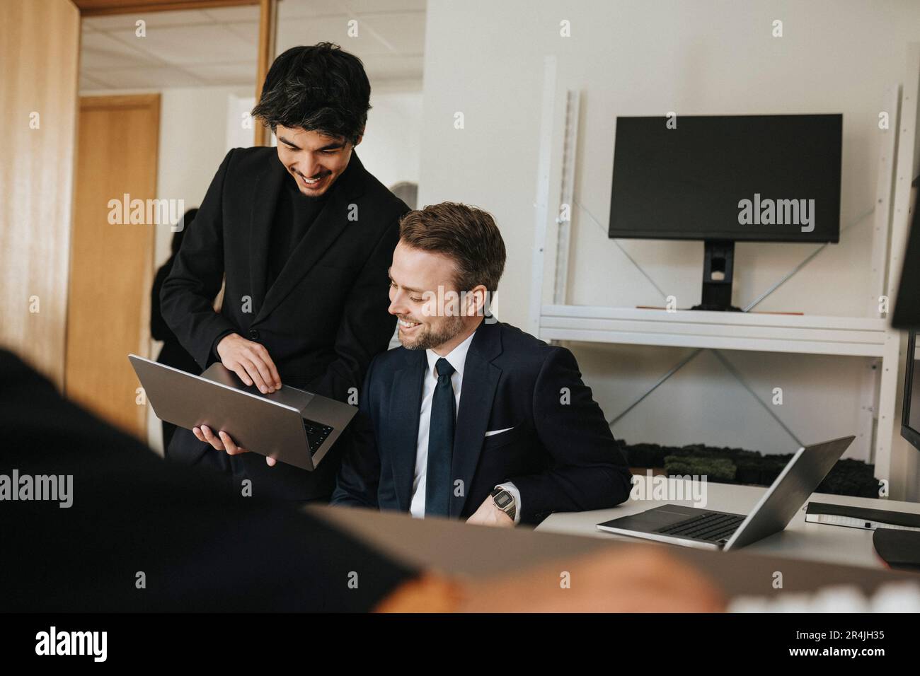 Businessman explaining over colleague hi-res stock photography and ...