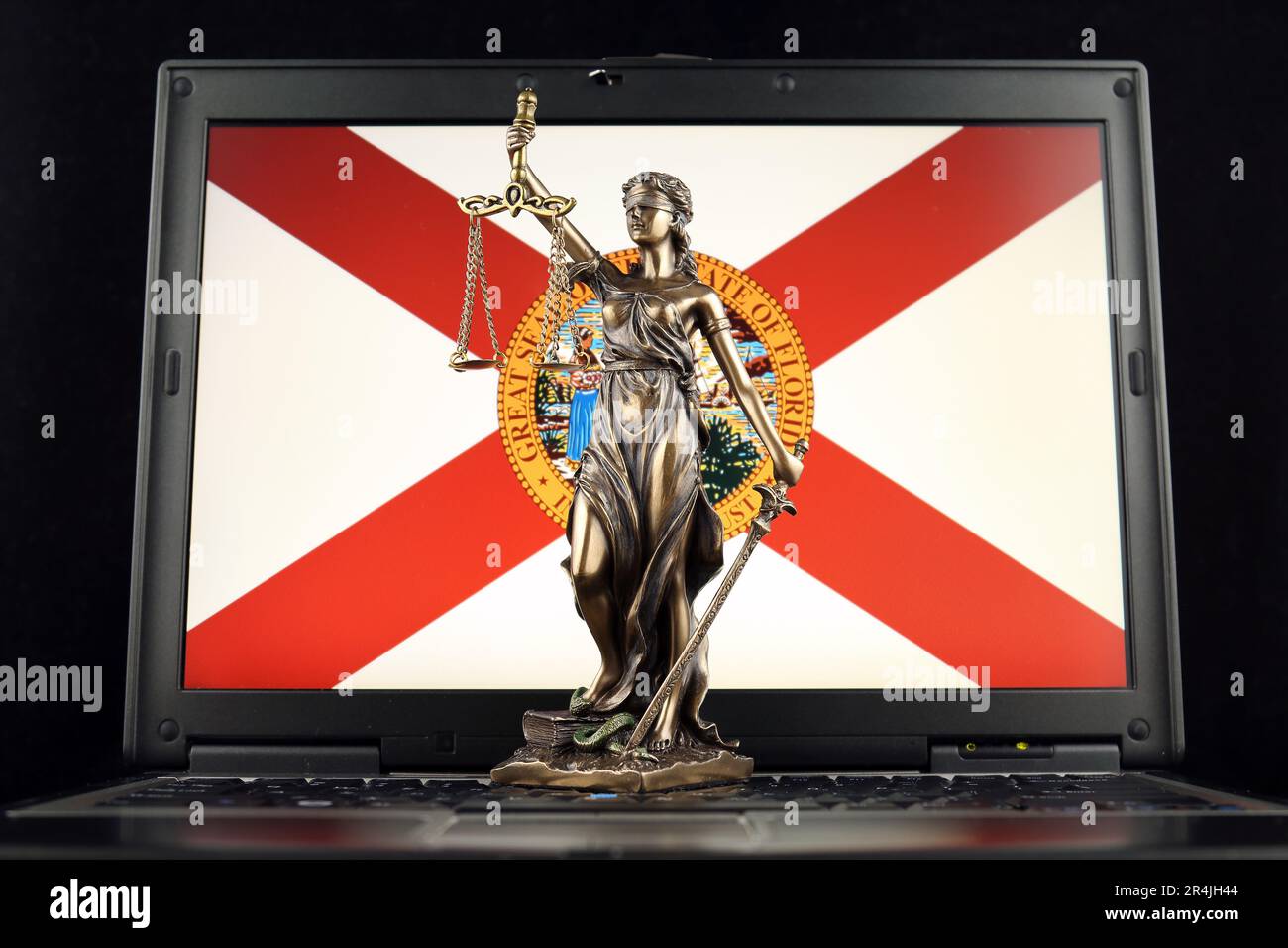 Symbol of law and justice with Florida State Flag on laptop. Studio ...