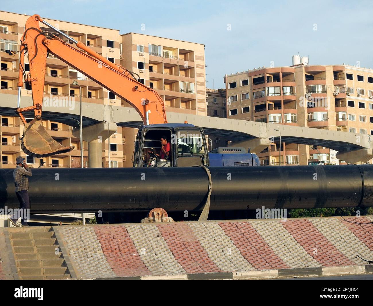 Cairo, Egypt, May 18 2023: preparations to place large water pipe parts ...
