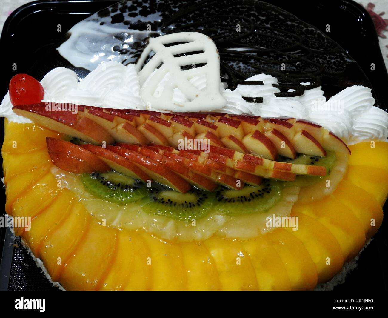 Selective focus of a fresh birthday cake with white chocolate, whipped ...