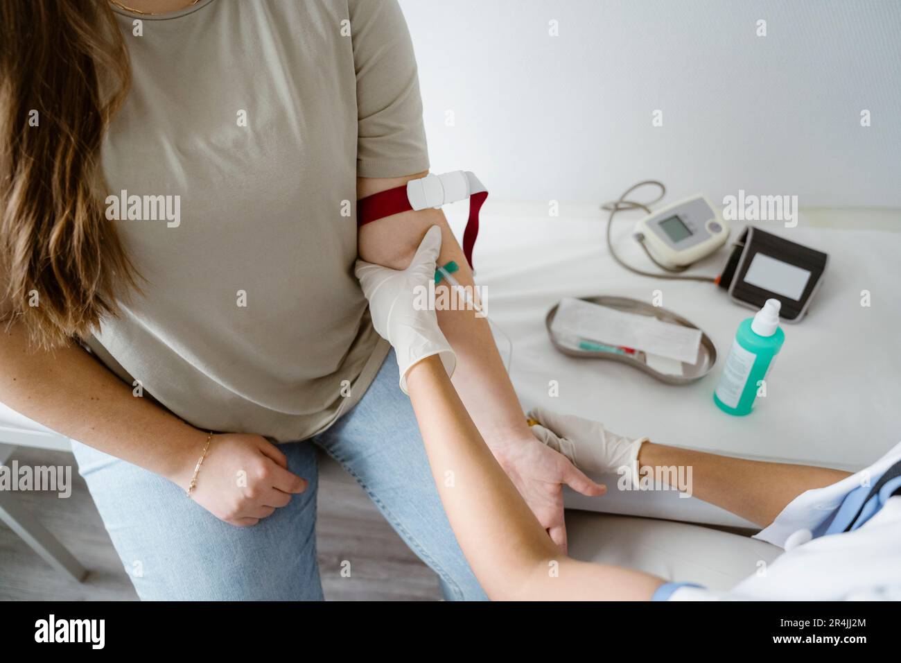 Hypodermic arm tourniquet hi-res stock photography and images - Alamy
