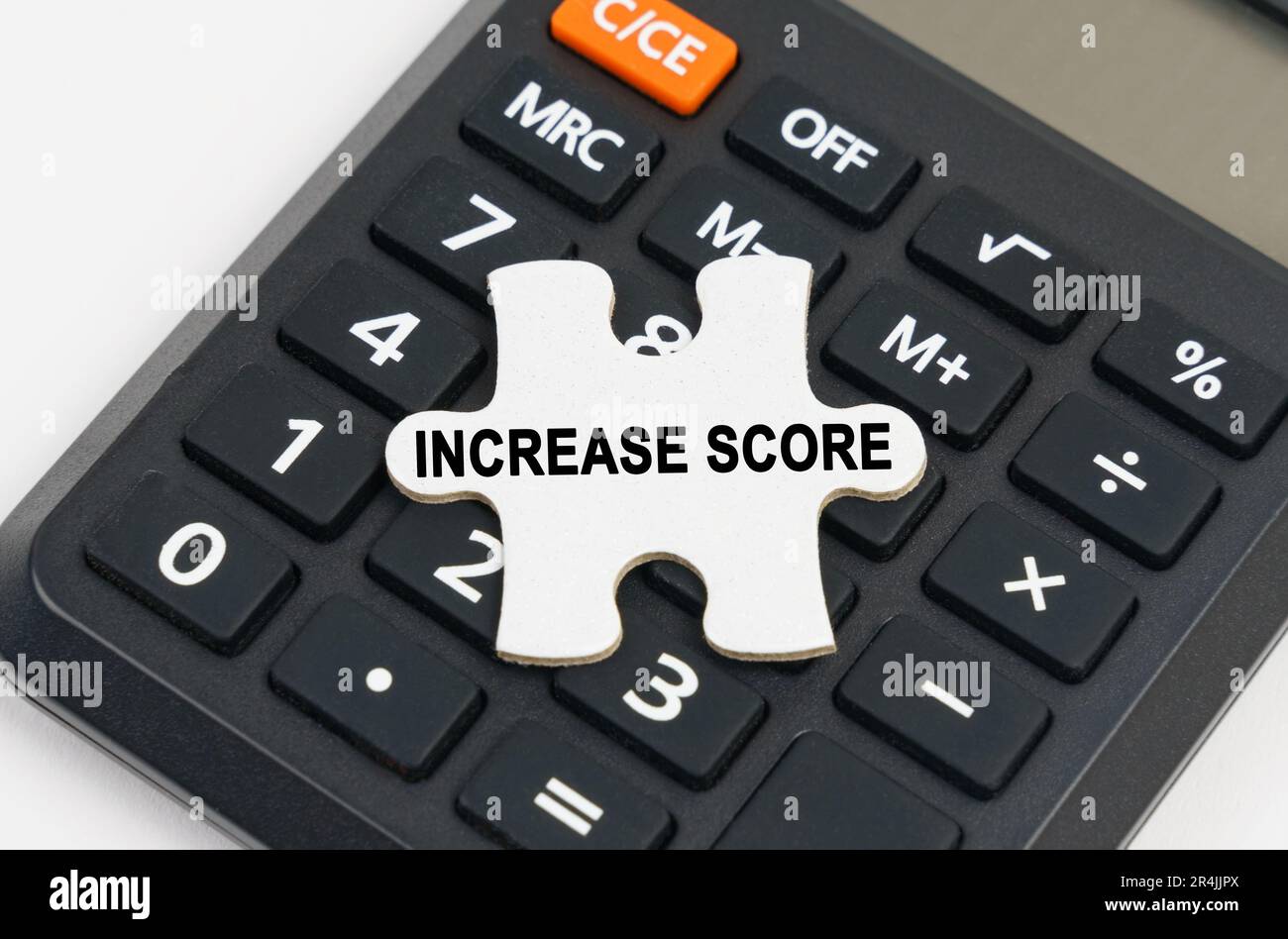 Business concept. On the calculator is a puzzle with the inscription ...