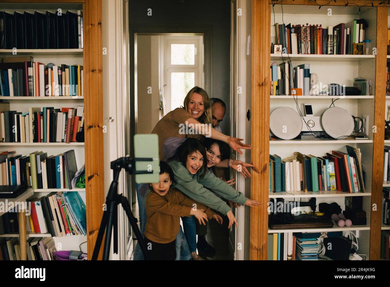 Happy family filming dance on smart phone at home Stock Photo - Alamy