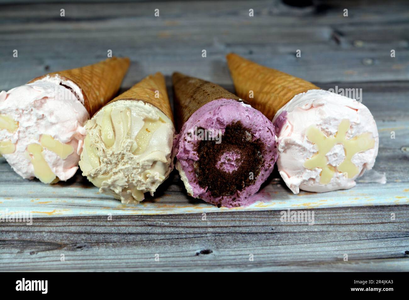 Ice-cream of special flavors in crispy wafer cones, melting cold ice ...