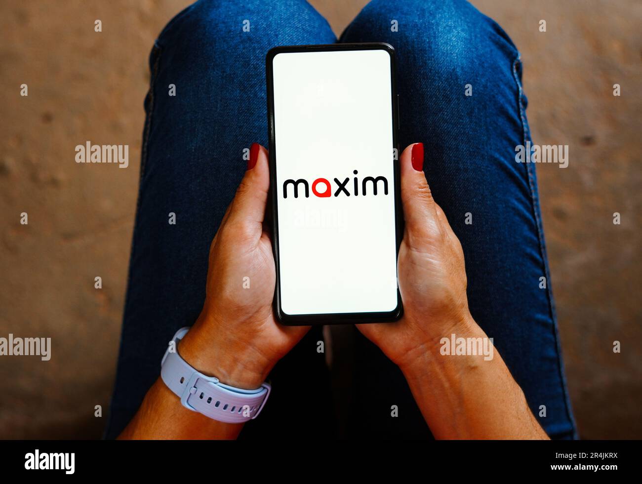 In this photo illustration, the Maxim logo is displayed on a smartphone ...
