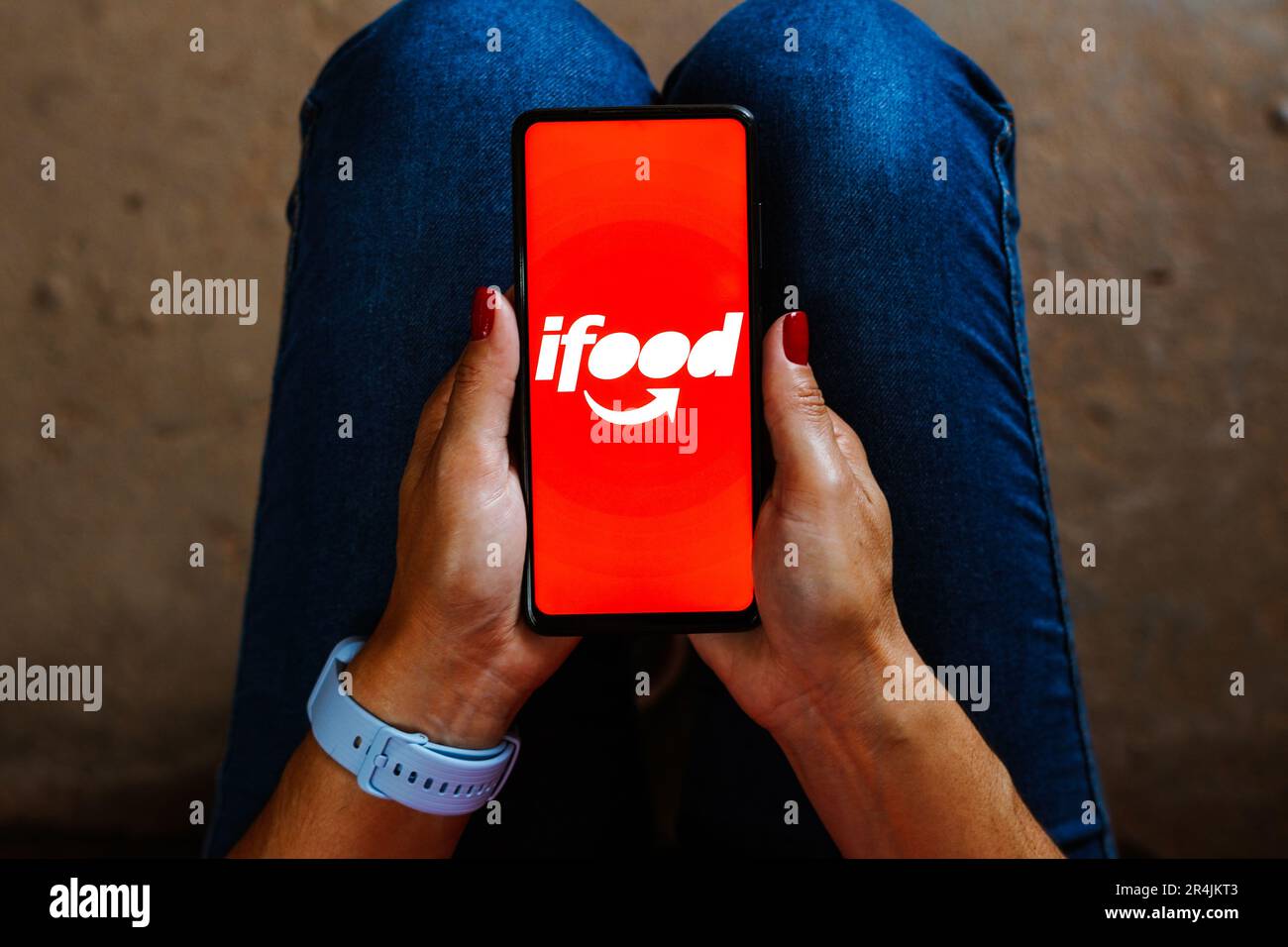 In this photo illustration, the iFood logo is displayed on a smartphone ...