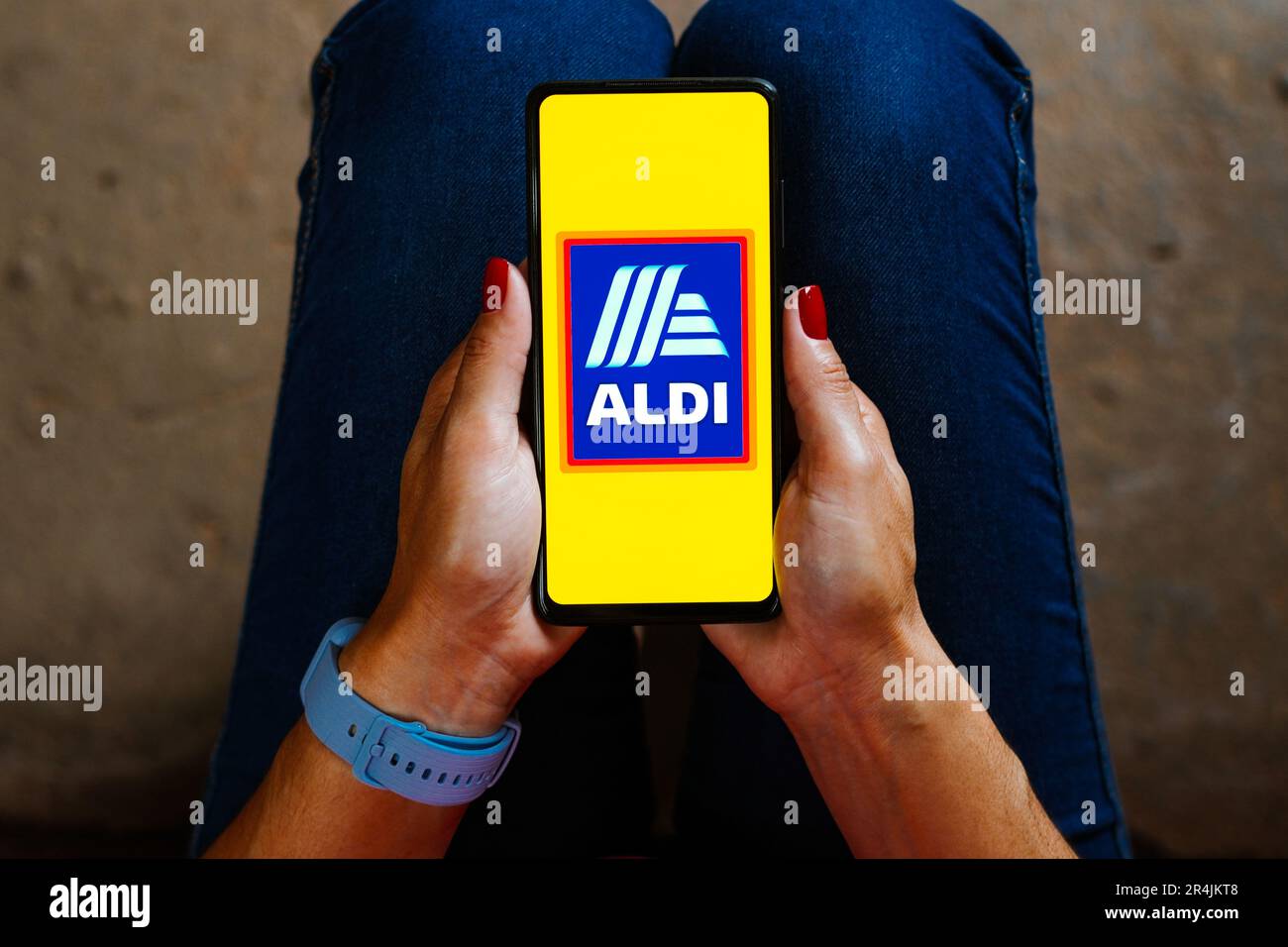 In this photo illustration, the Aldi logo is displayed on a smartphone ...