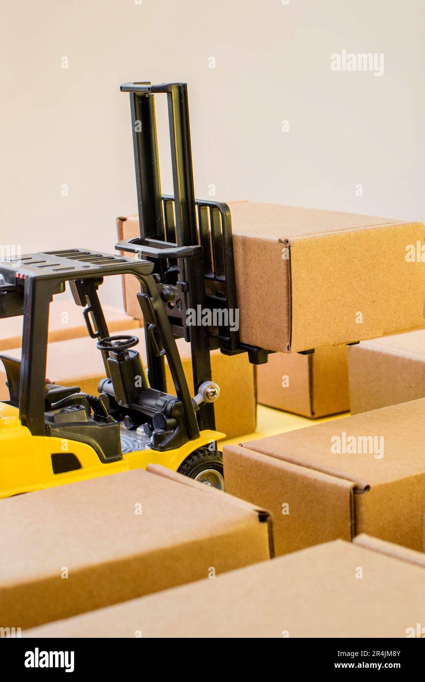 Warehouse with cardboard kraft boxes and a forklift truck. Cargo ...