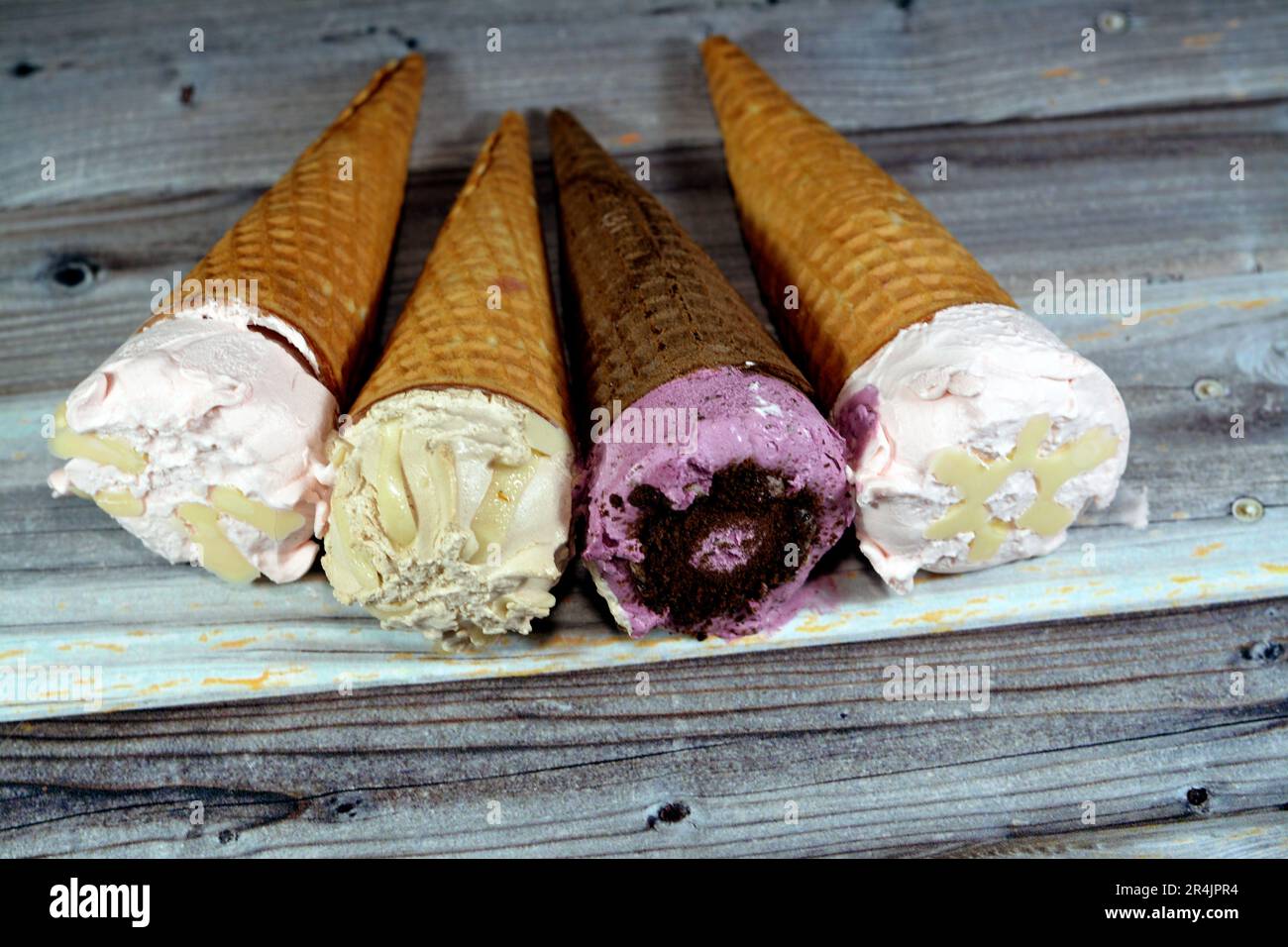 Ice-cream of special flavors in crispy wafer cones, melting cold ice ...