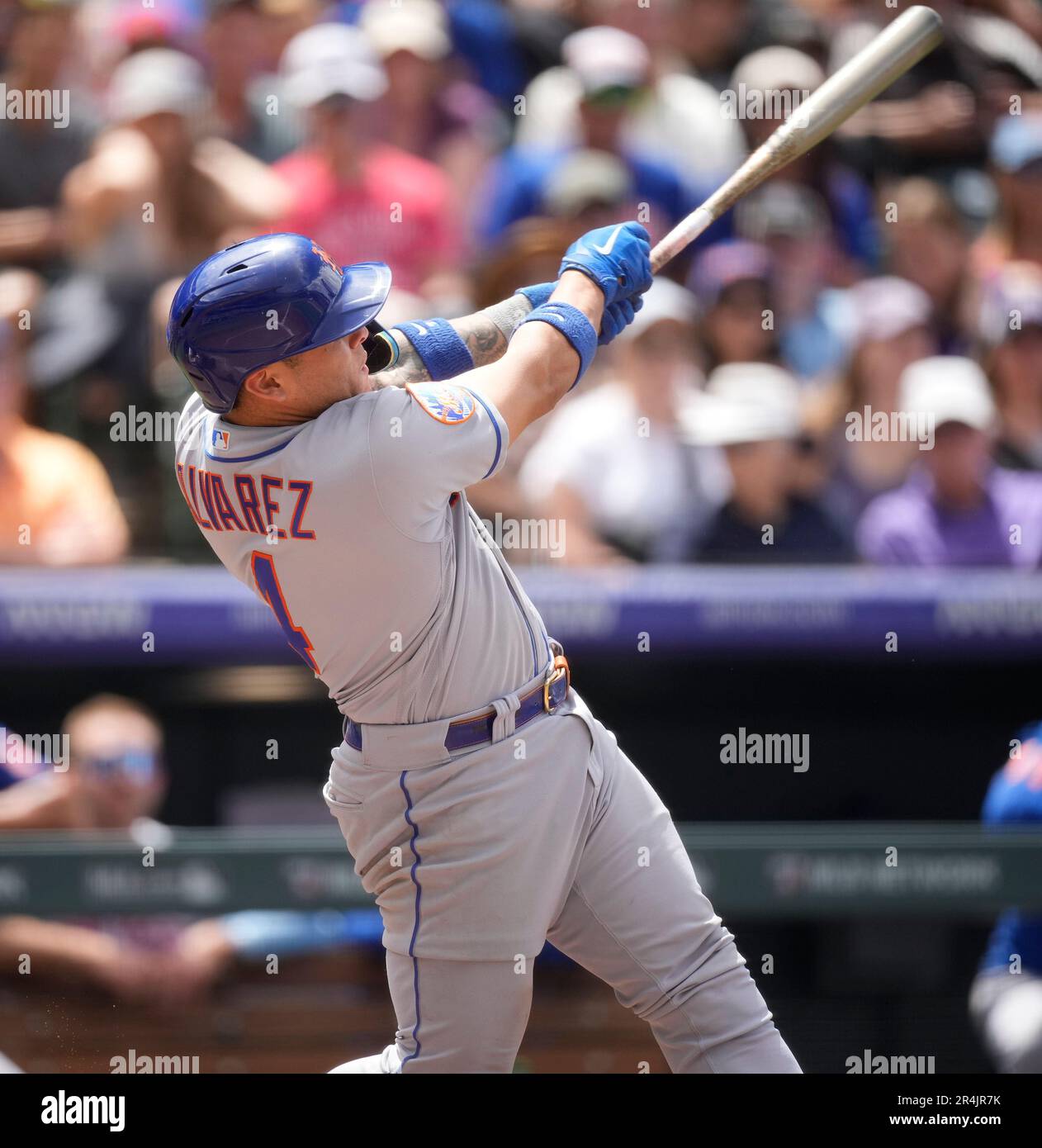 New York Mets' Francisco Alvarez follows through with his swing after ...