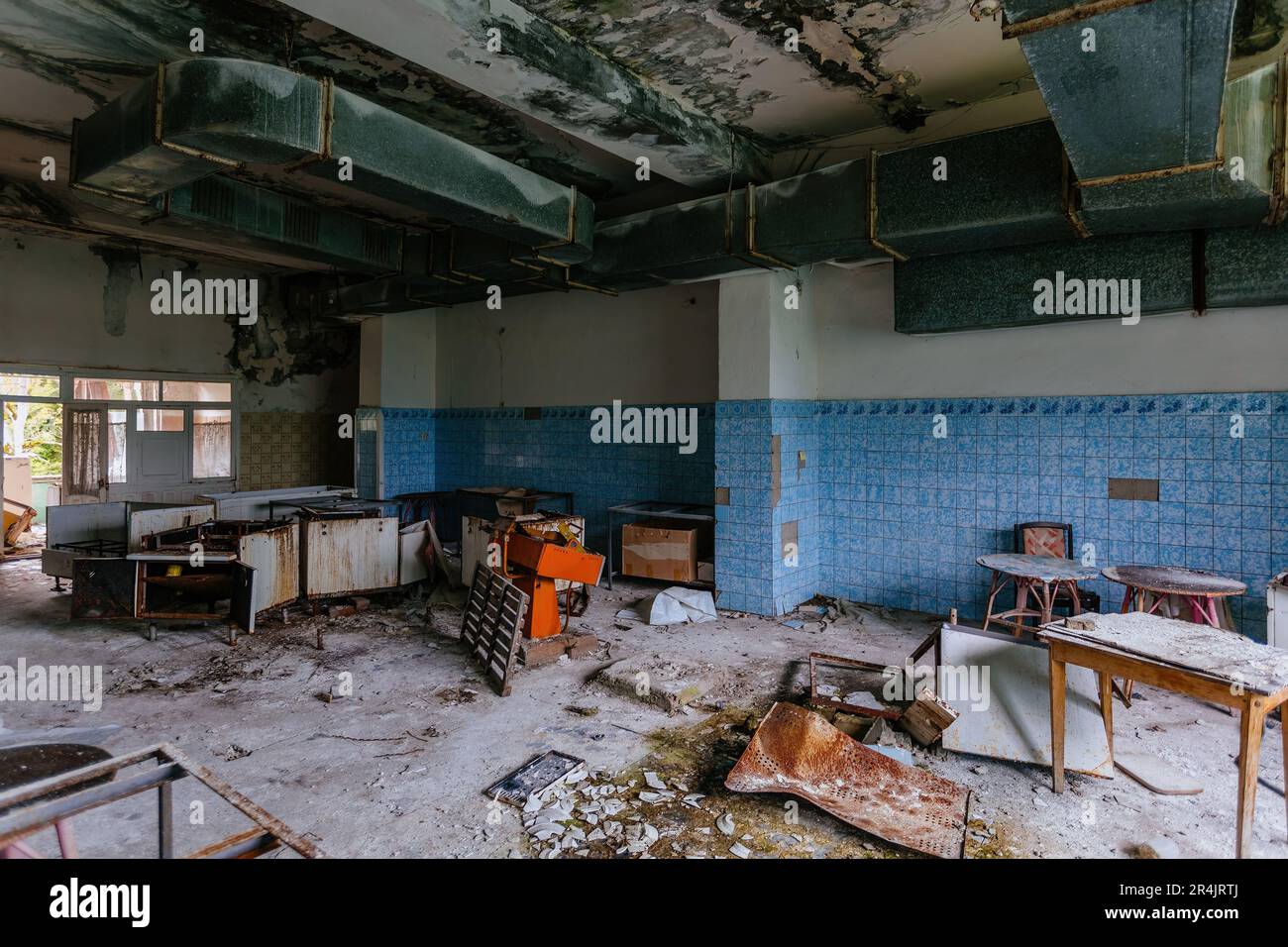 Abandoned and ruined kitchen of closed factory canteen or restaurant ...