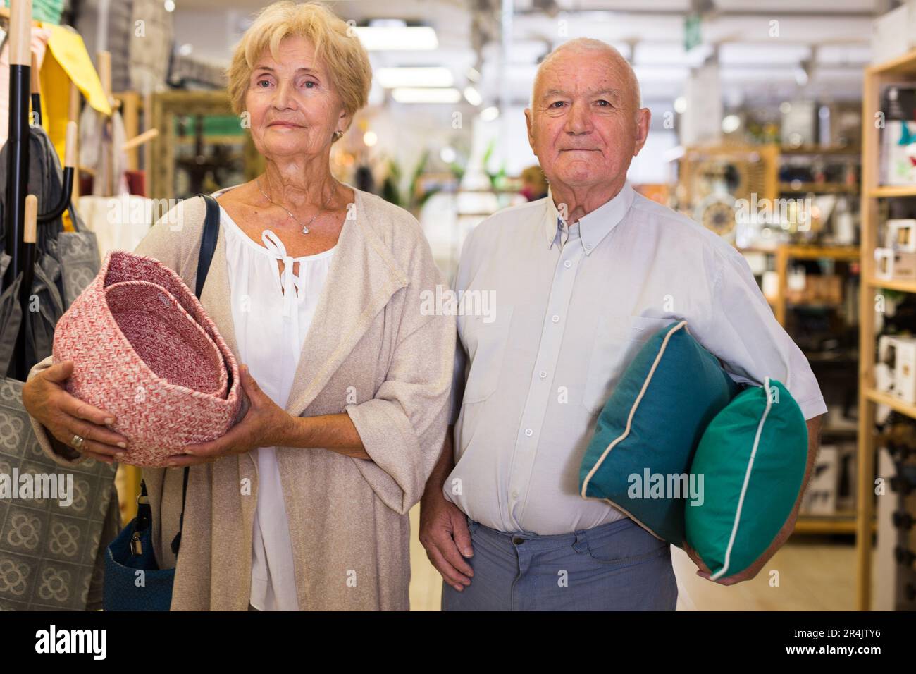 Mature family couple shopping at household store Stock Photo - Alamy