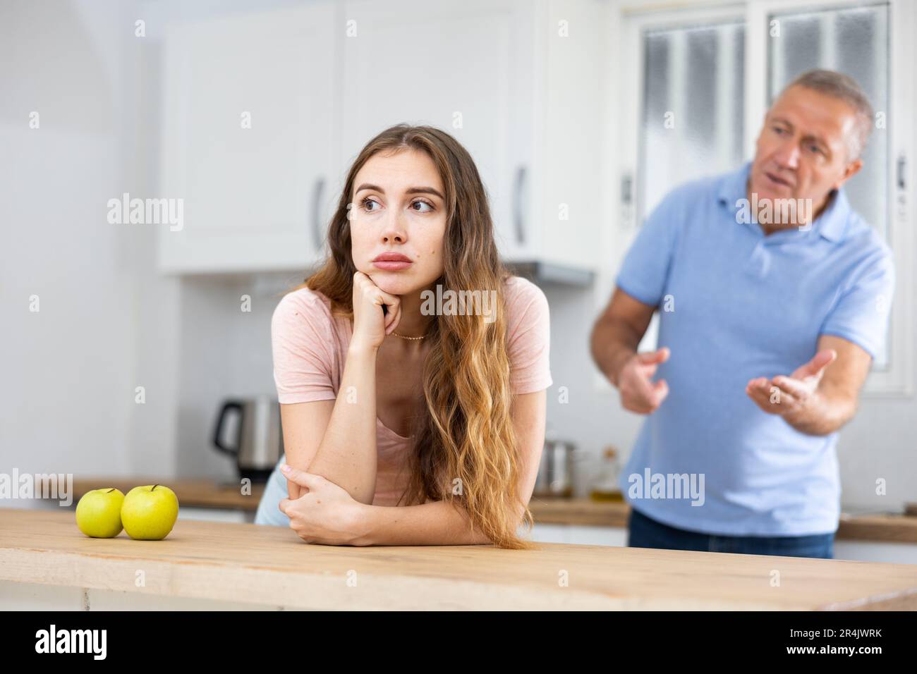 Daughter father scolding and yelling at her in home kitchen Stock Photo ...