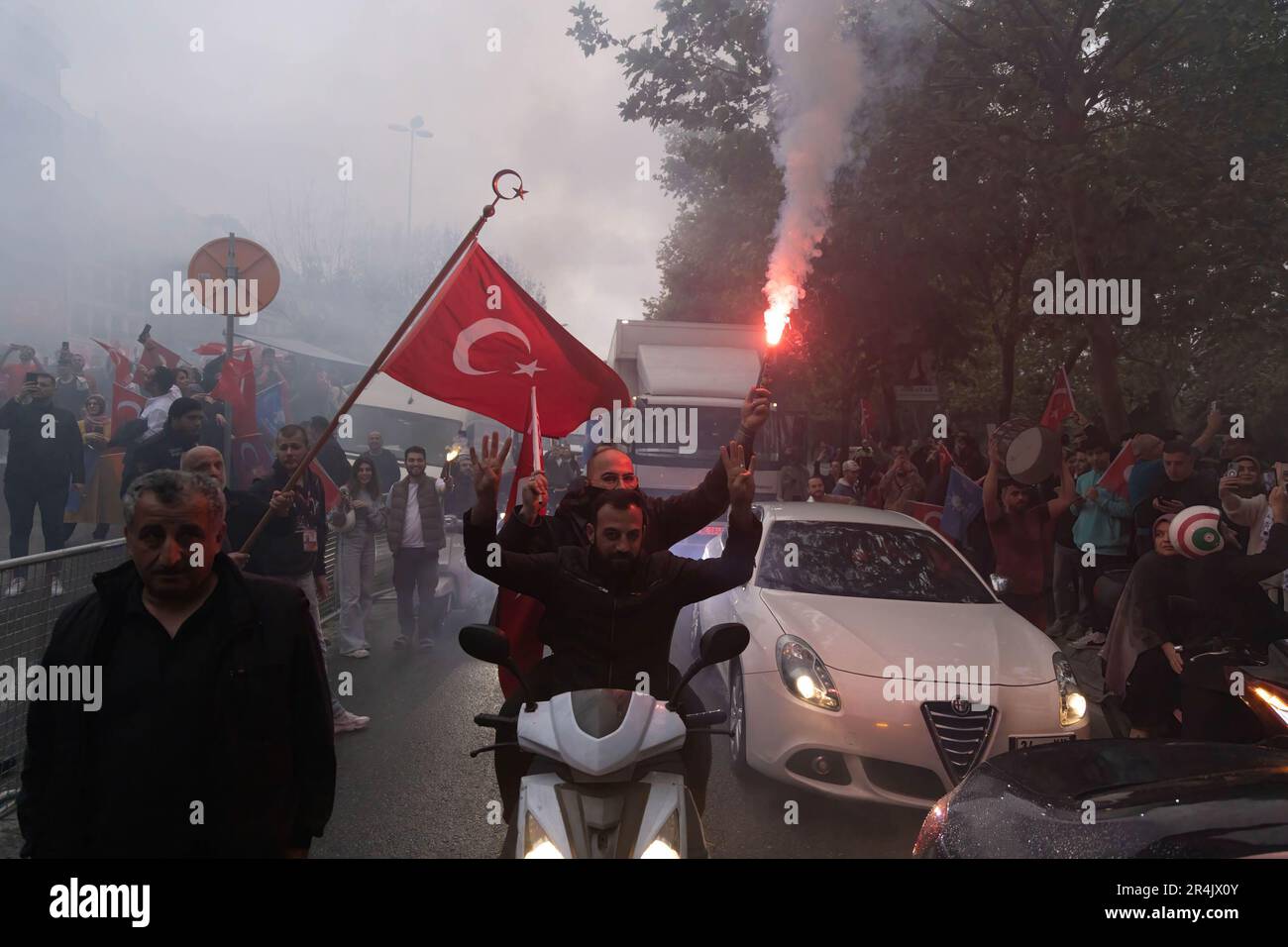 Supporters of the President Recep Tayyip Erdogan celebrate outside AK ...