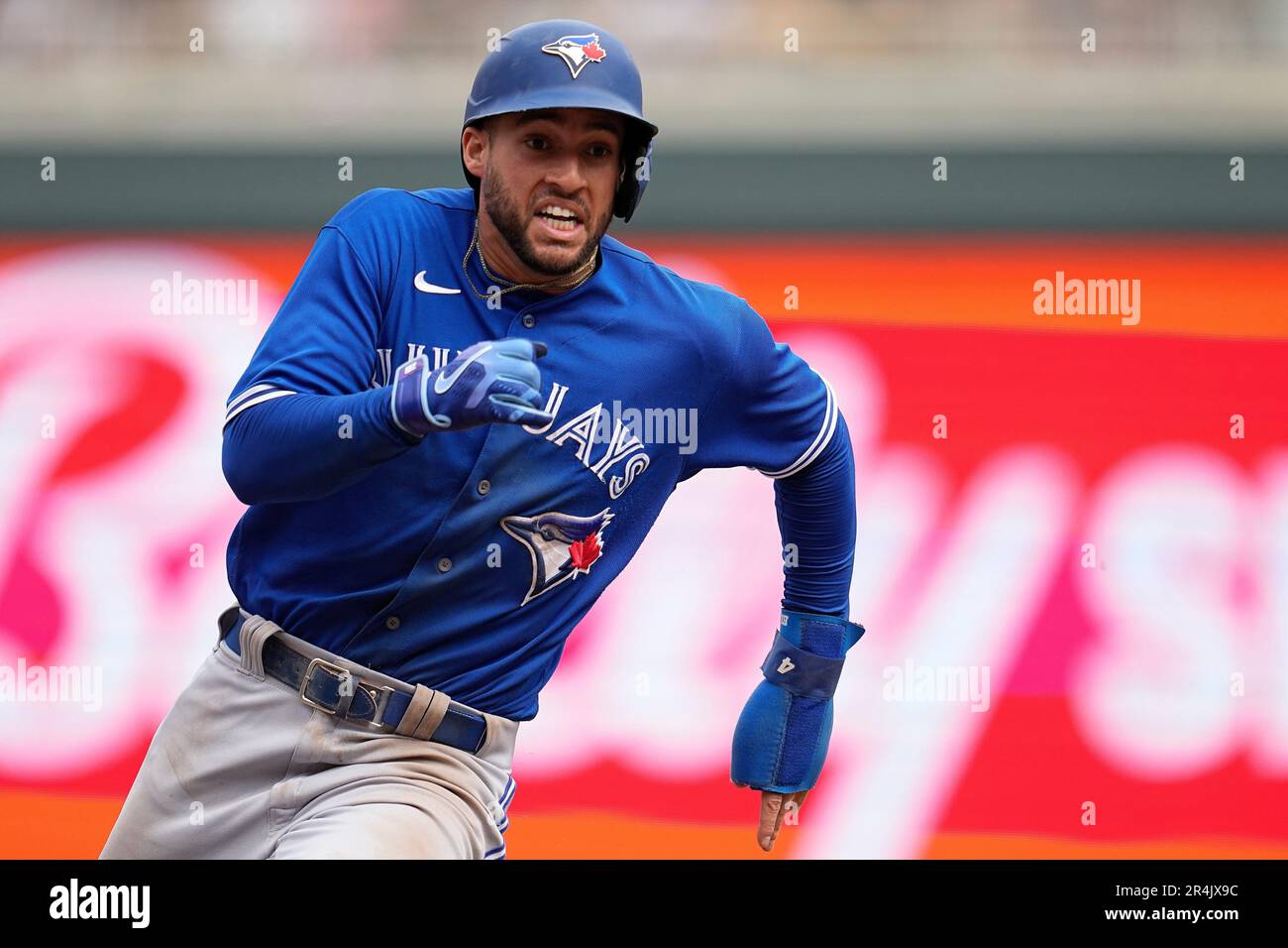 Toronto Blue Jays' George Springer runs to score off a fielding error ...