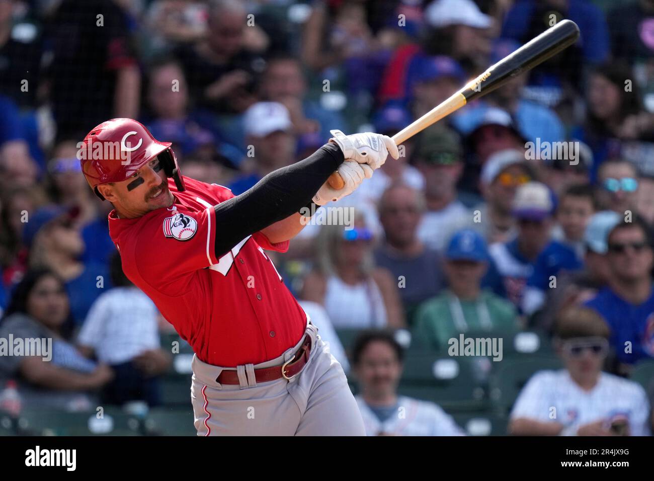 Cincinnati Reds' Spencer Steer hits a single during the eighth inning ...