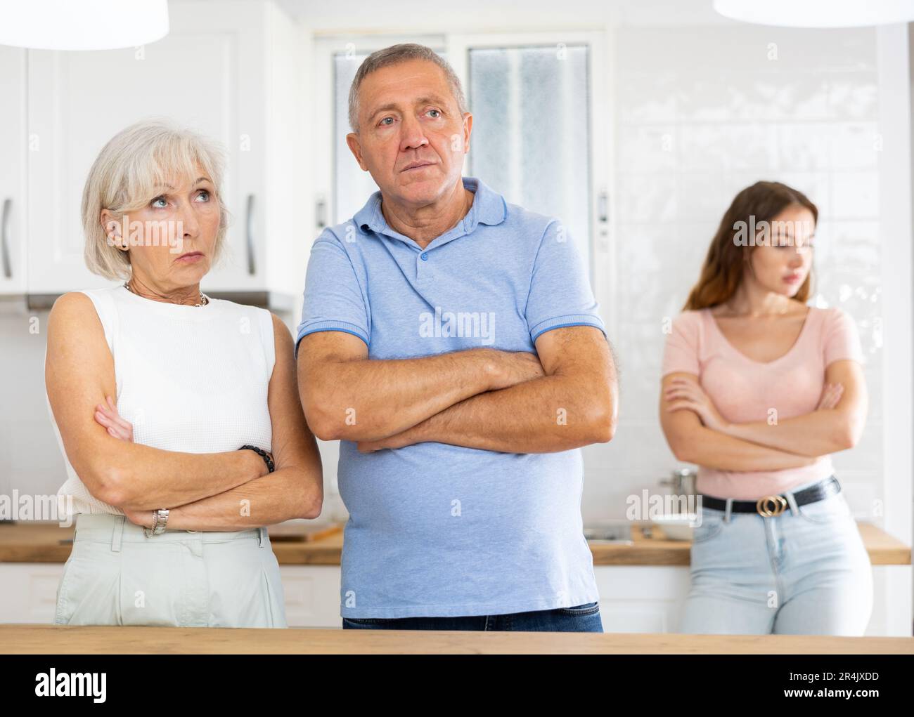 Upset father standing in the kitchen Stock Photo - Alamy