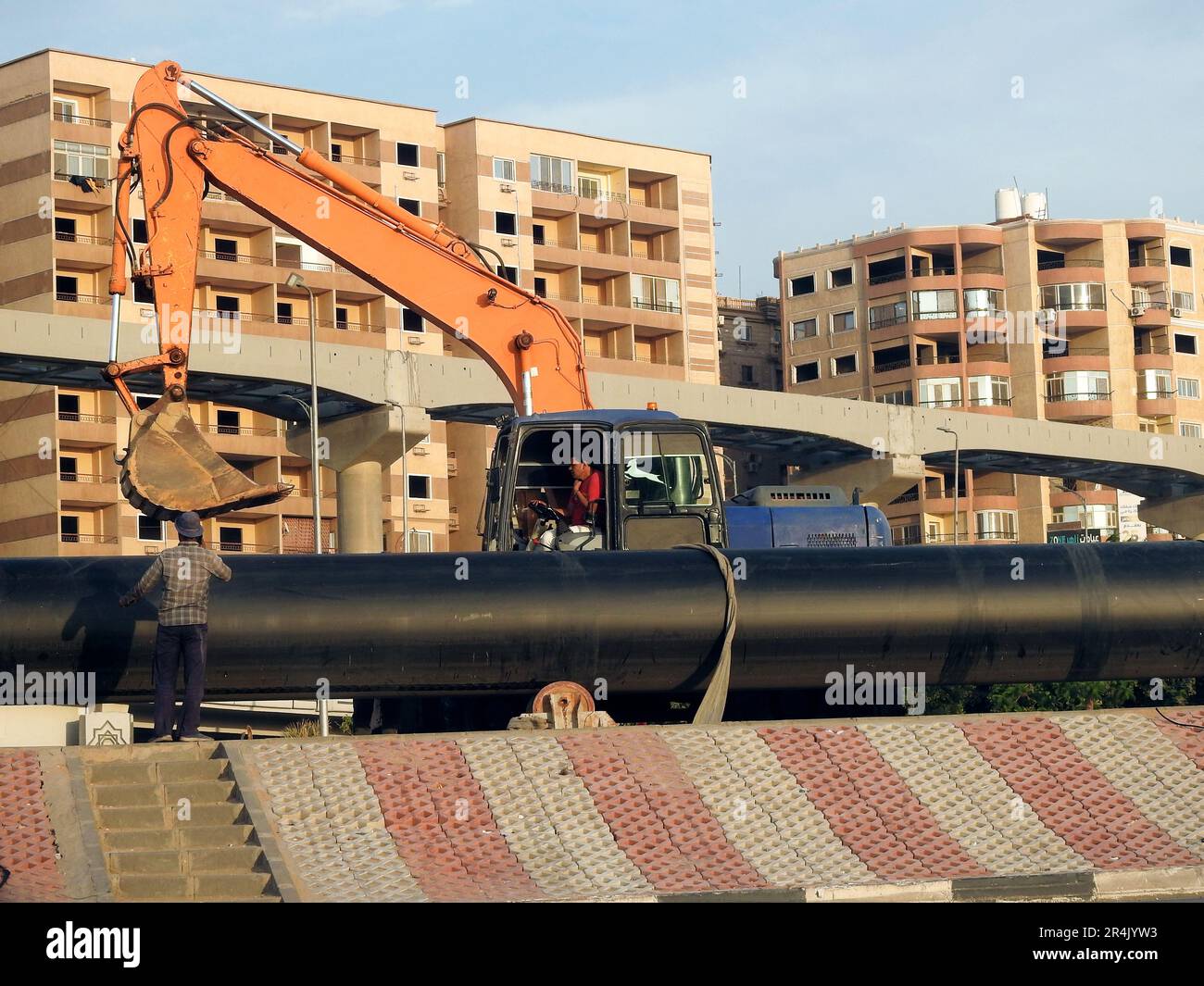 Cairo, Egypt, May 18 2023: preparations to place large water pipe parts ...