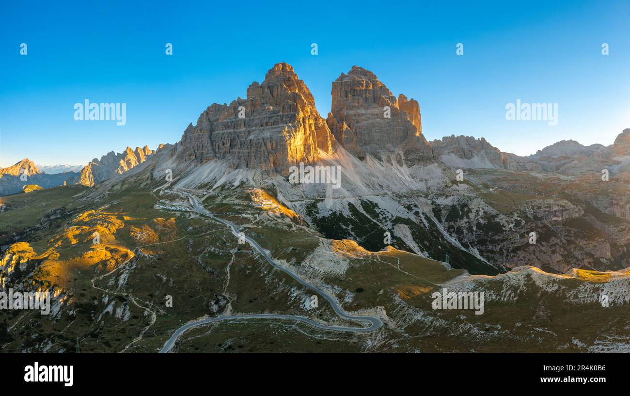 Sharp faces of high mountains at sunrise. Illuminated by sun rays rocky ...
