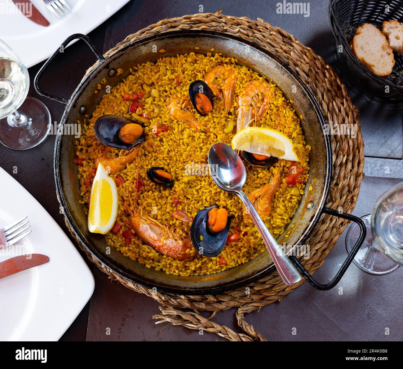 Spanish rice dish paella tinted with saffron. Prepared with olive oil ...