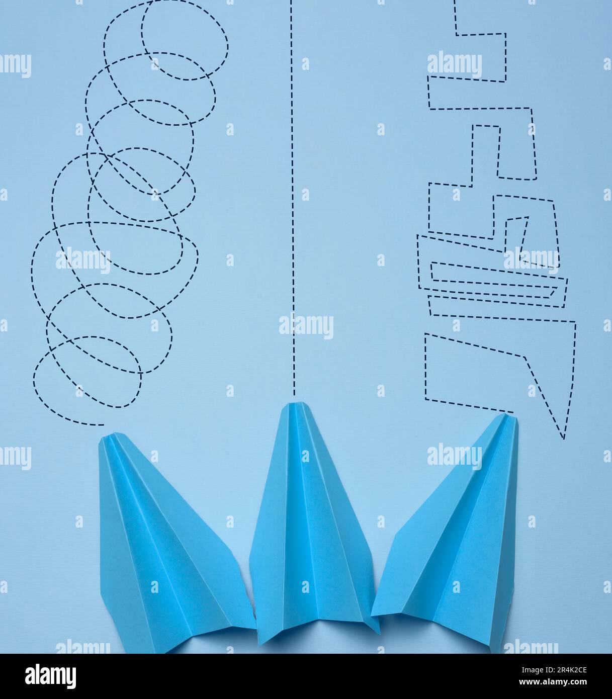 Three paper blue planes with different trajectories, the concept of ...